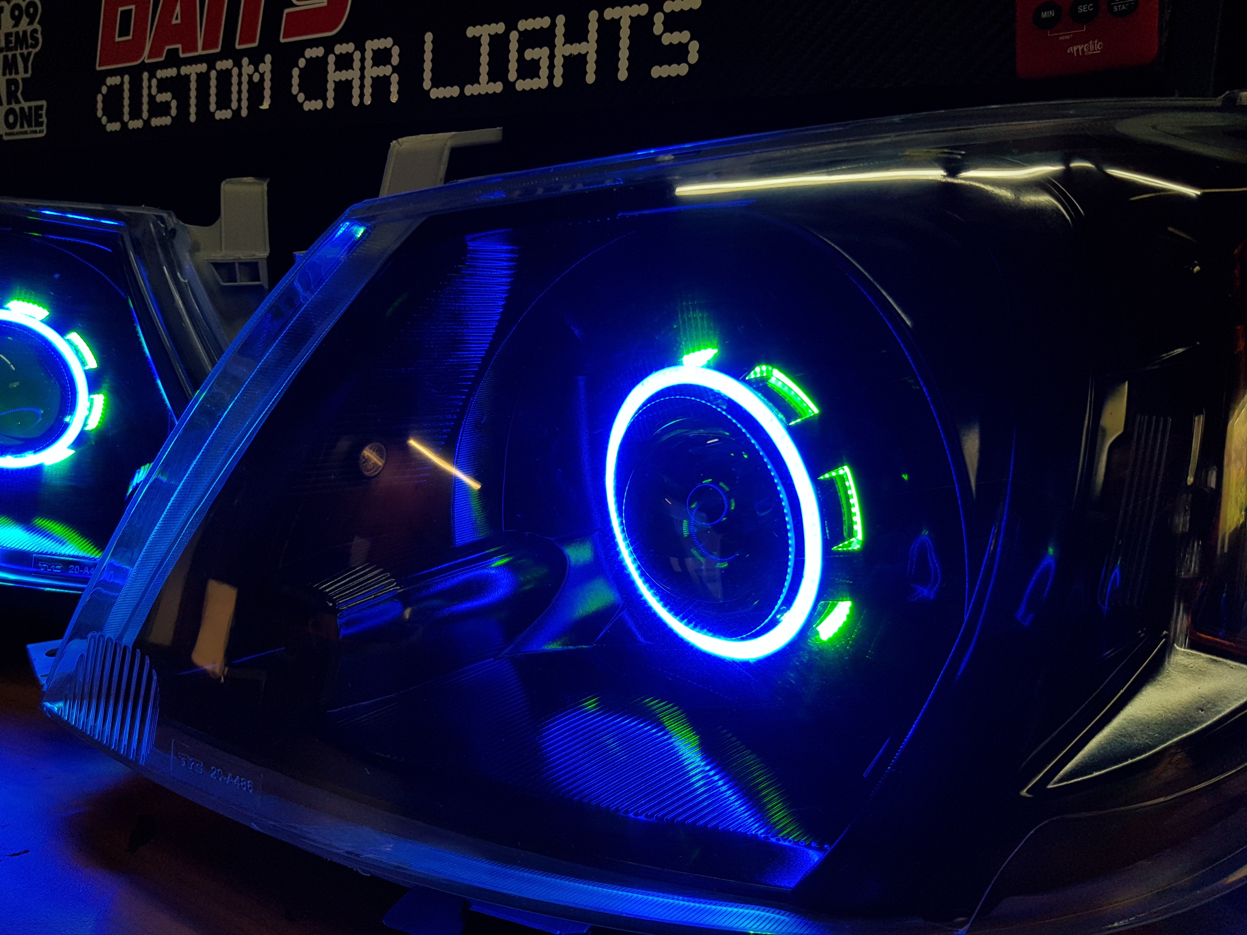 Toyota Hilux 2005 -2015 with Projectors and Dual Multicoloured Halo ...
